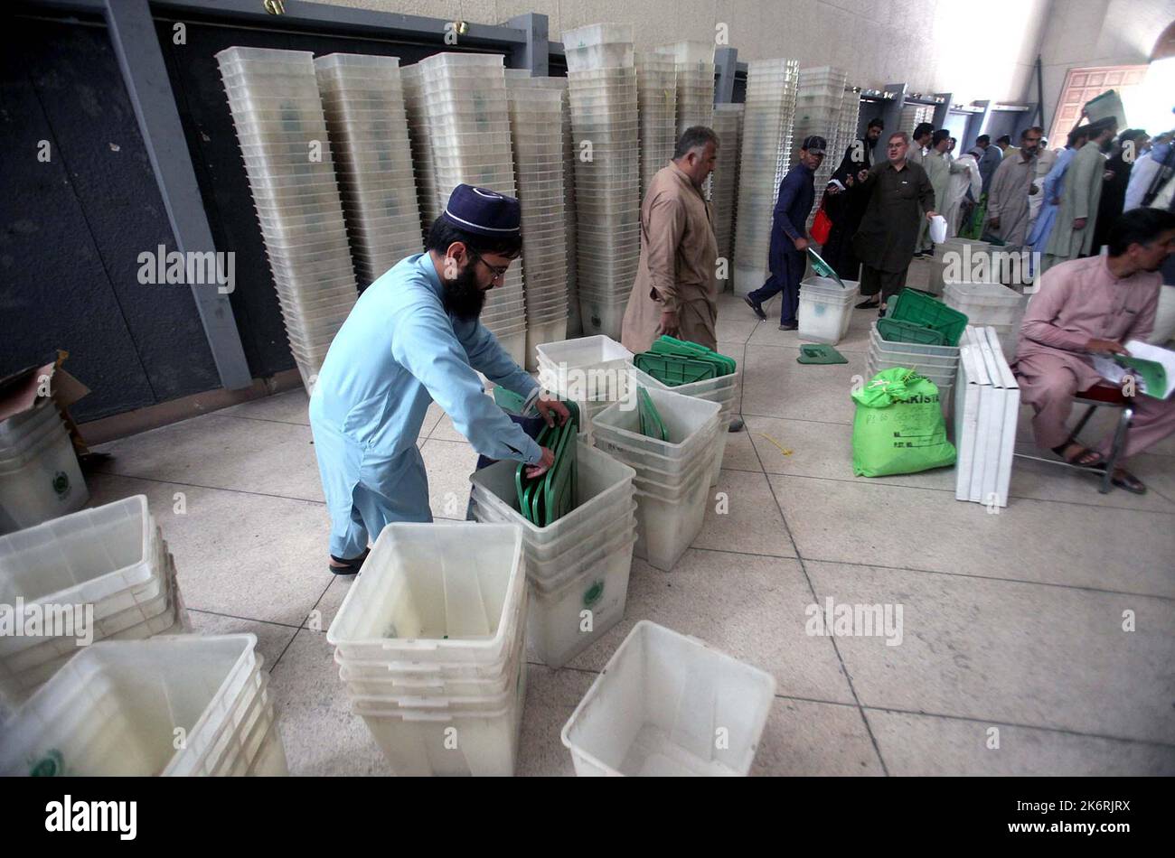 Election staff carry ballot boxes hi-res stock photography and images ...