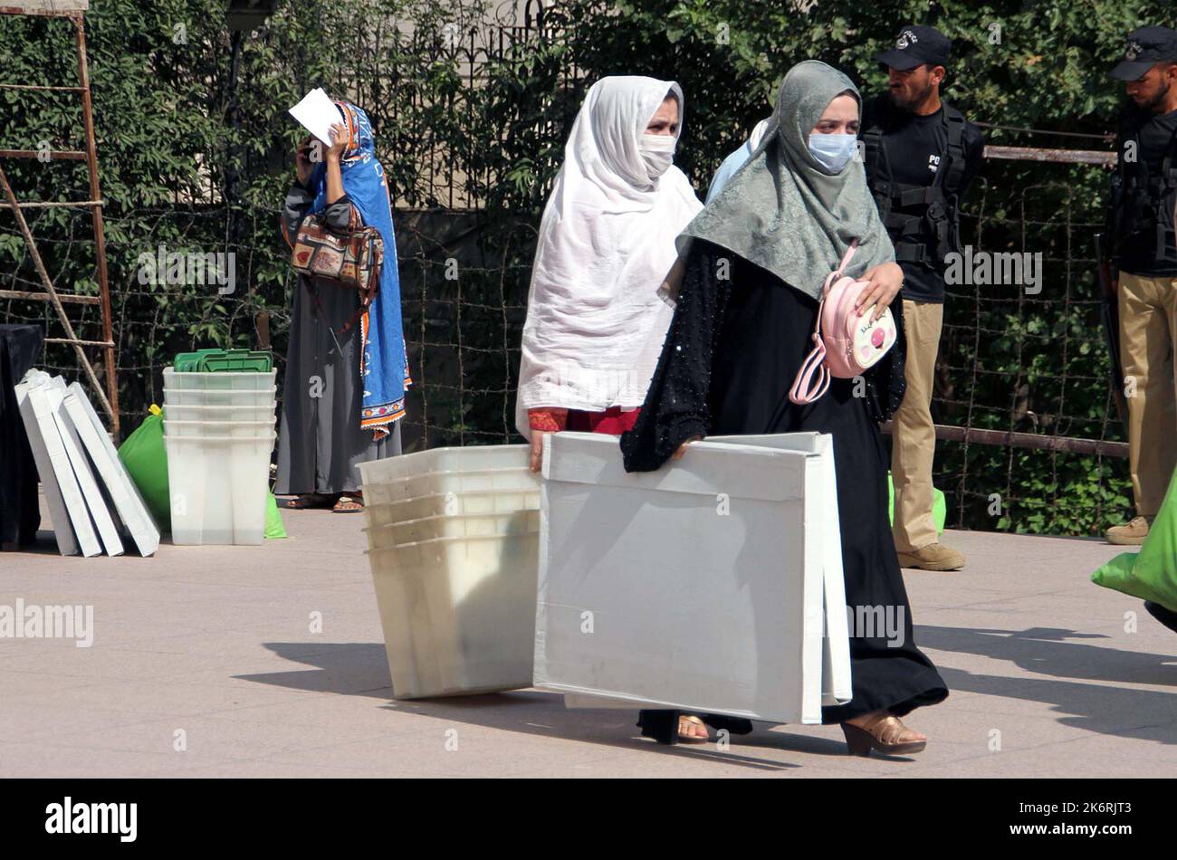 Election staff carry ballot boxes hi-res stock photography and images ...