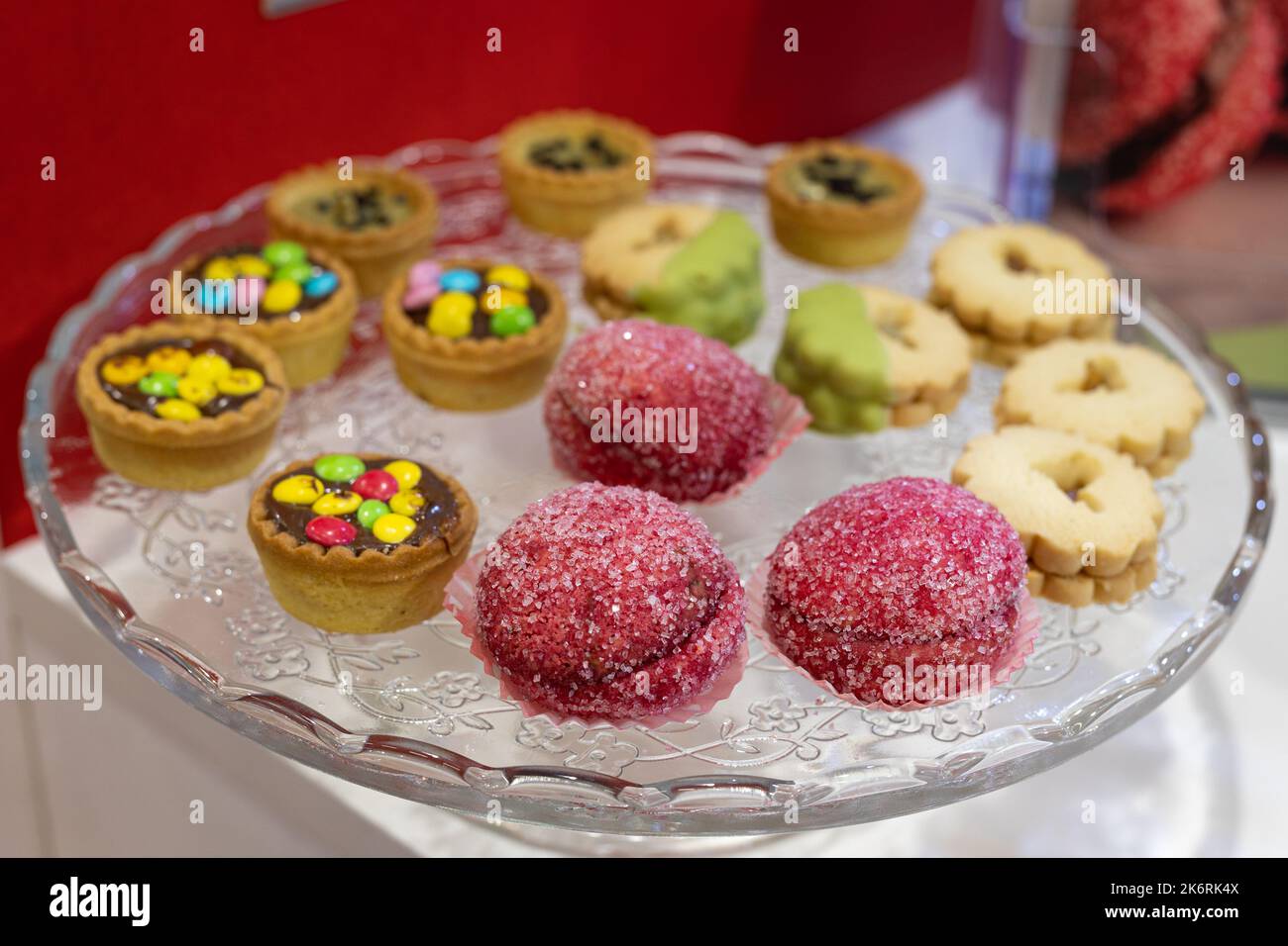 Chocolate, Shortbread, Red Sugar-coated Pastries Displayed above a ...
