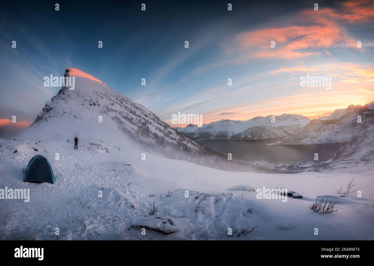Panorama stunning view of sunrise over snowy mountain range with ...