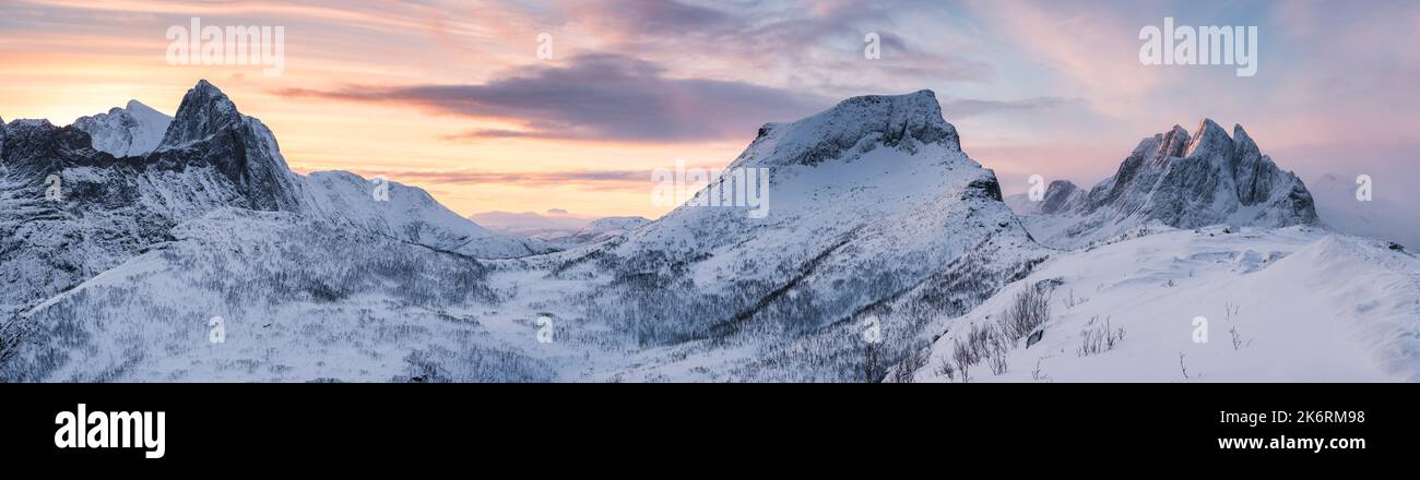 Panorama stunning view of sunrise over snowy mountain range with ...