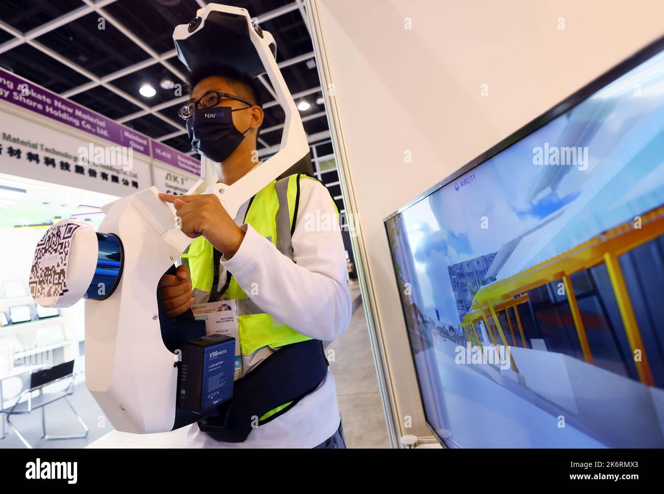 A mobile 3D laser scanner is demonstrated at the International ICT Expo ...