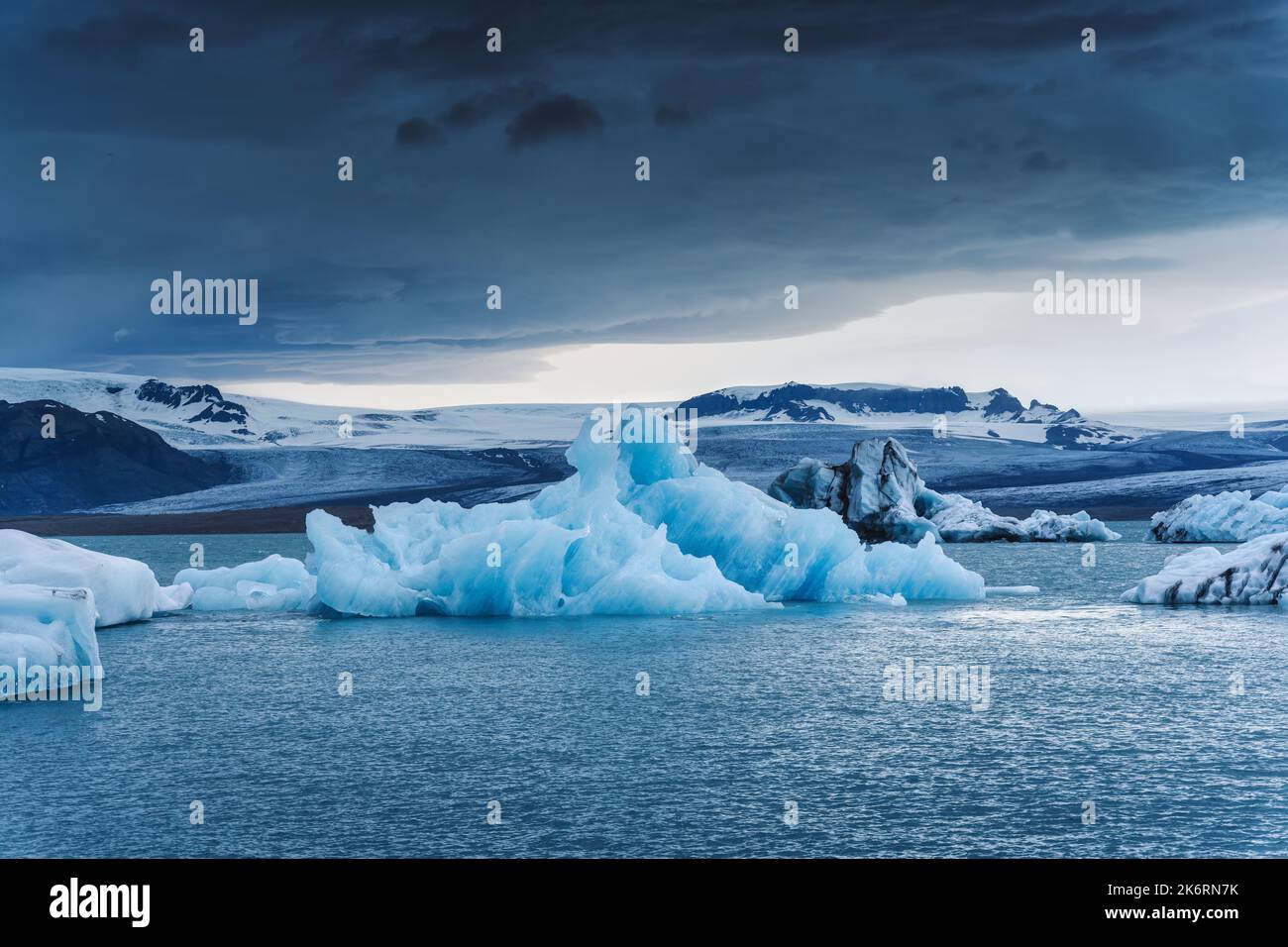Abstract blue iceberg floating in Jokulsarlon glacier lagoon at ...