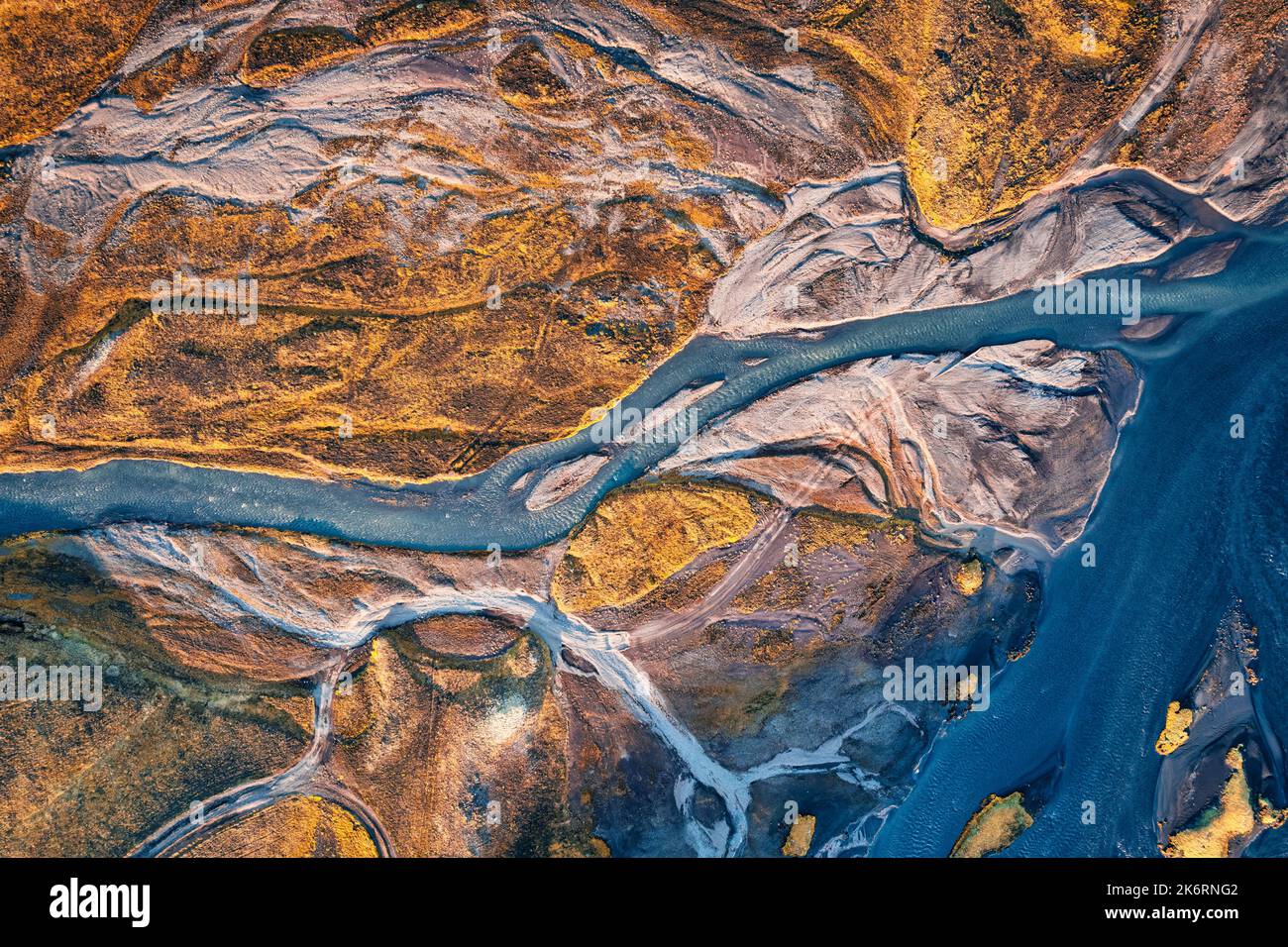 Top view of abstract glacier rivers pattern flowing through volcanic ...