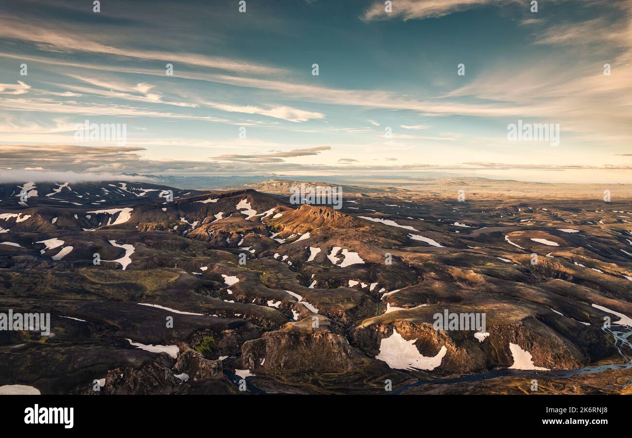 Aerial view of extraterrestrial volcanic lava field and glacier river ...