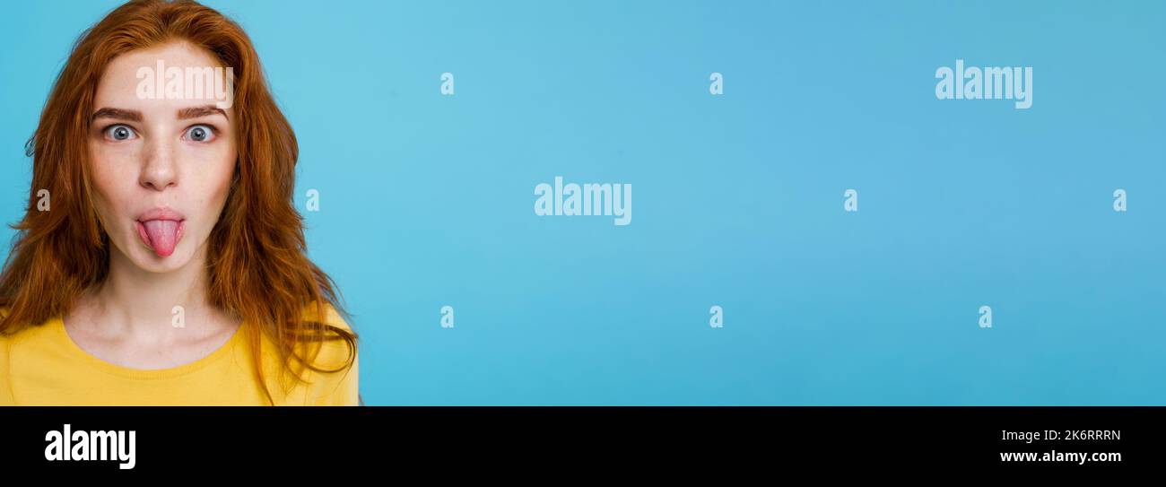 Headshot Portrait of happy ginger red hair girl with funny face looking ...