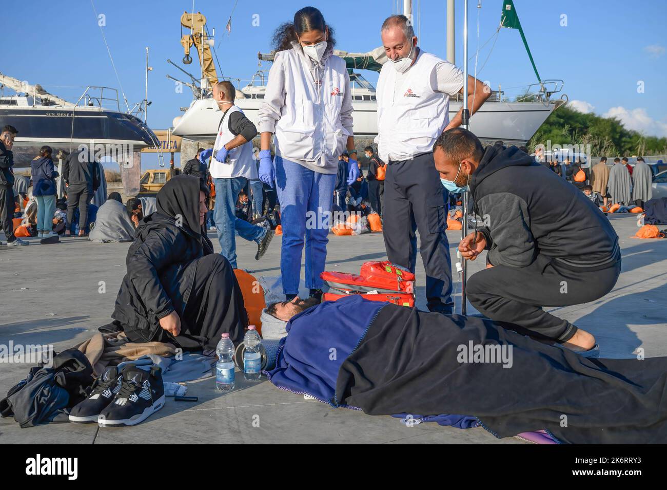 Members of Doctors Without Borders seen helping an Iraqi man and his ...