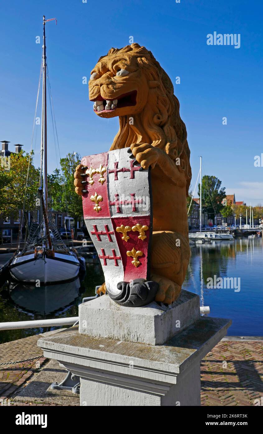 Three centuries old lion standing at the corner of the Lions bridge in ...
