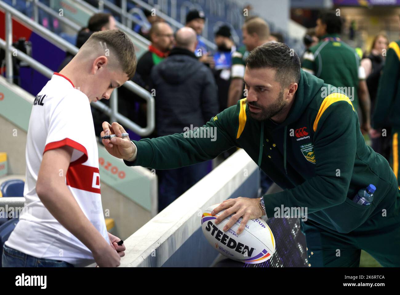 Australia's James Tedesco signs a fans shirt prior to kick-off before ...