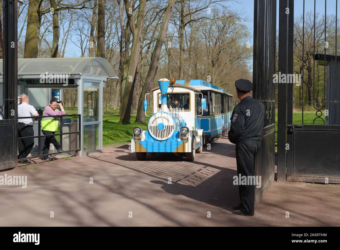 Brother train, a tourist road train entering the Lower park of Peterhof ...