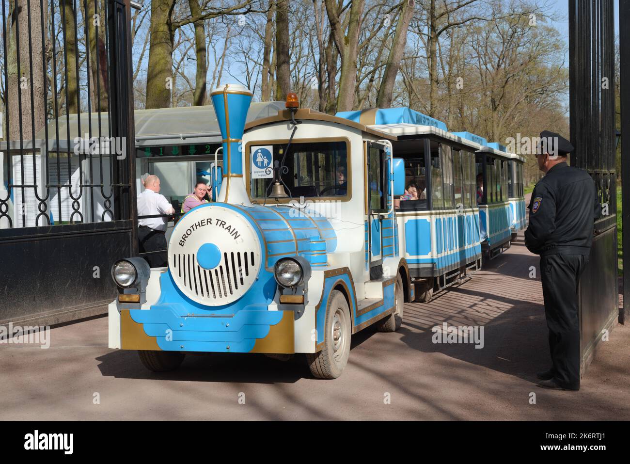 Brother train, a tourist road train entering the Lower park of Peterhof ...