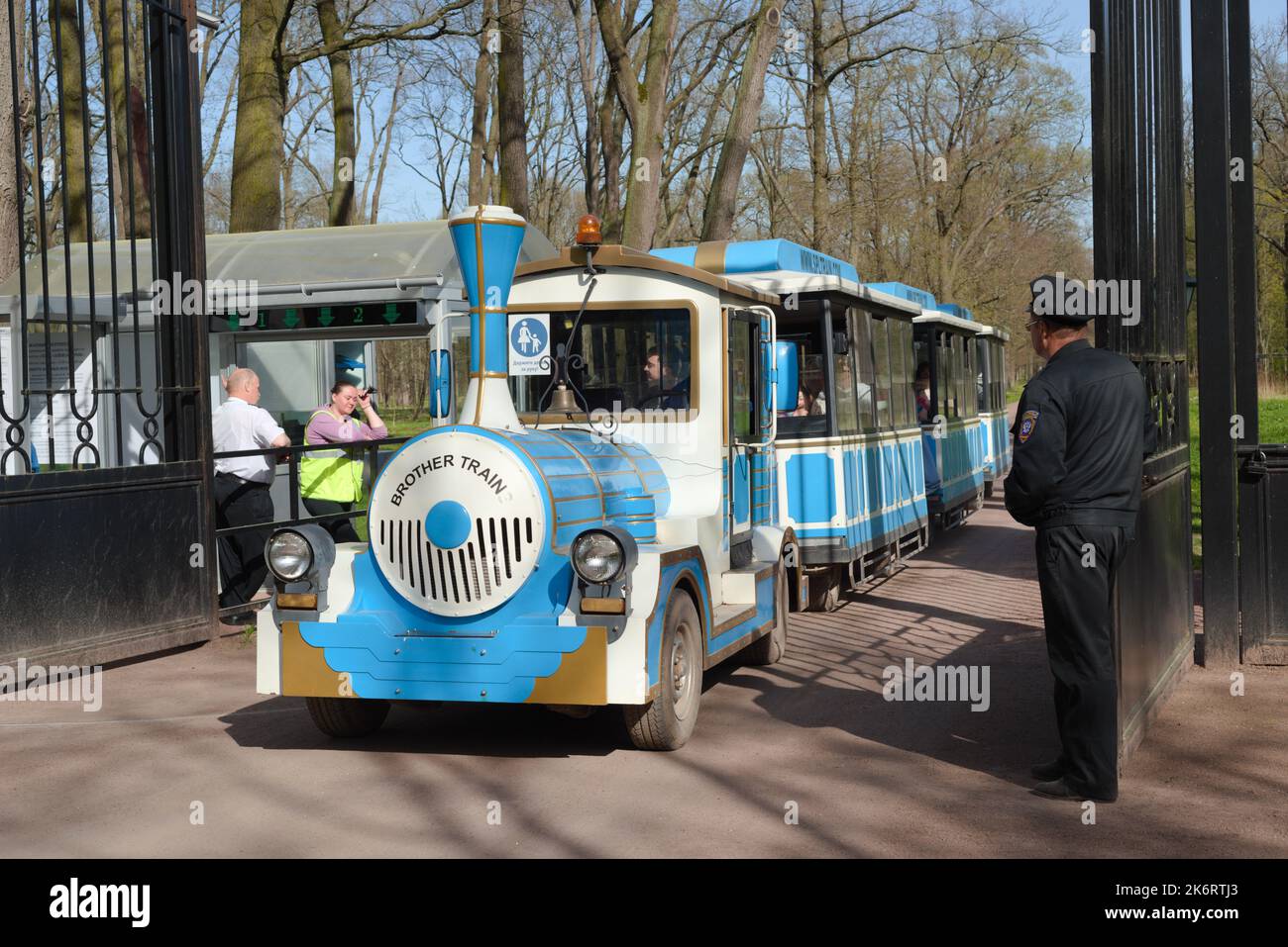 Brother train, a tourist road train entering the Lower park of Peterhof ...