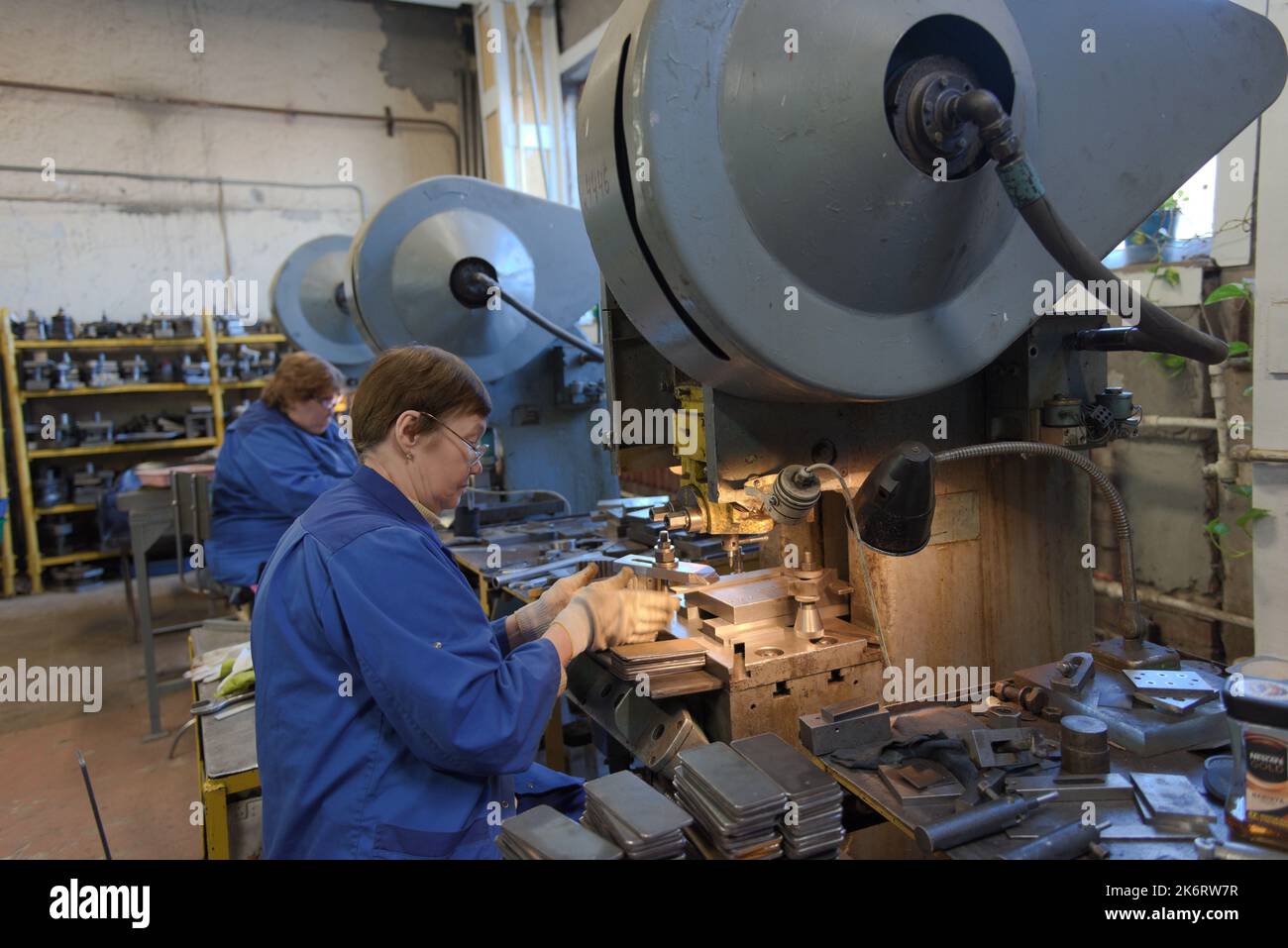 Female workers of the holding Lenpolygraphmash on their workplaces. The ... Female workers of the holding Lenpolygraphmash on their workplaces. The ...