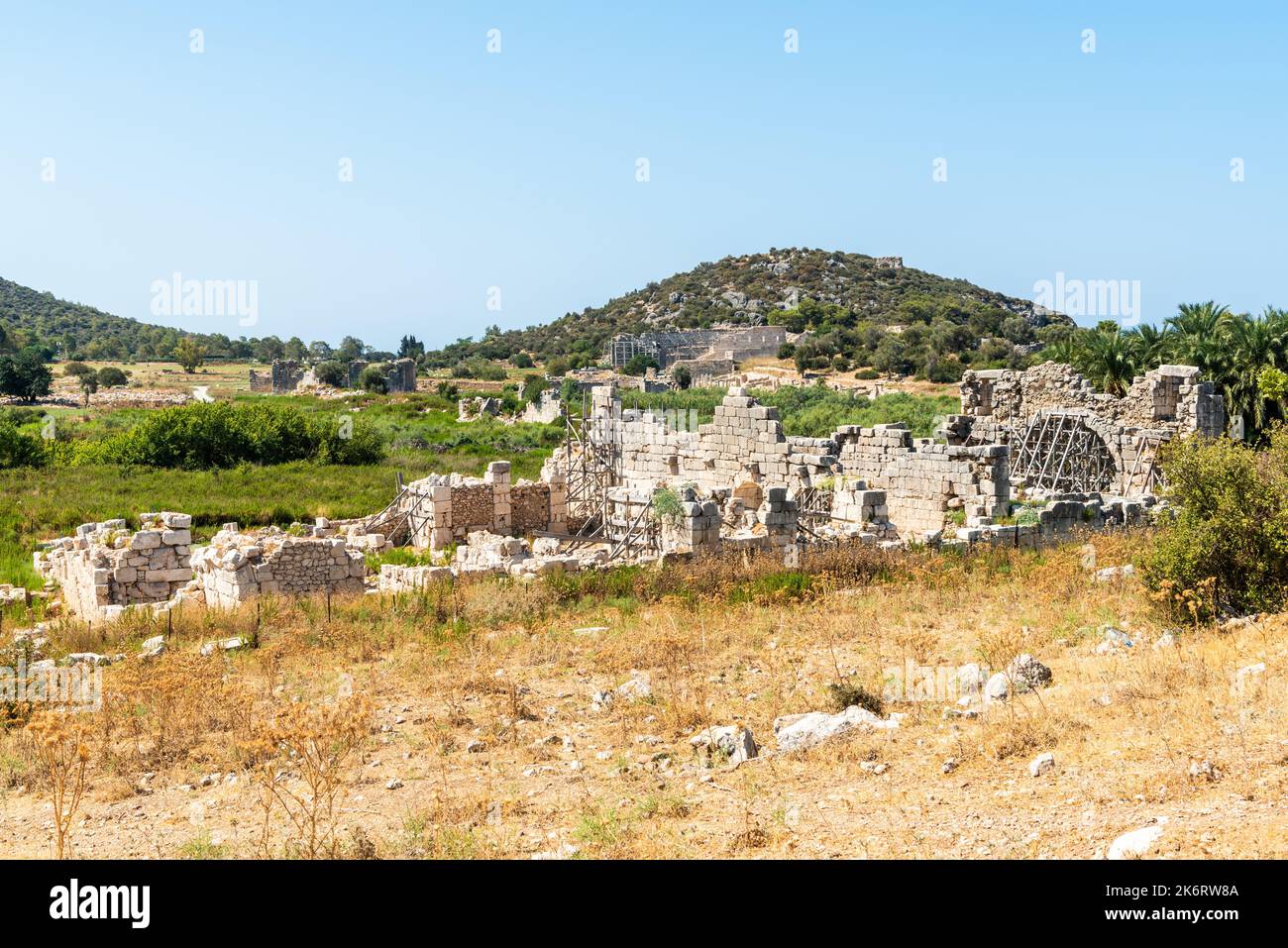 View over the ruins of the Harbour Bath at Patara ancient site in ...