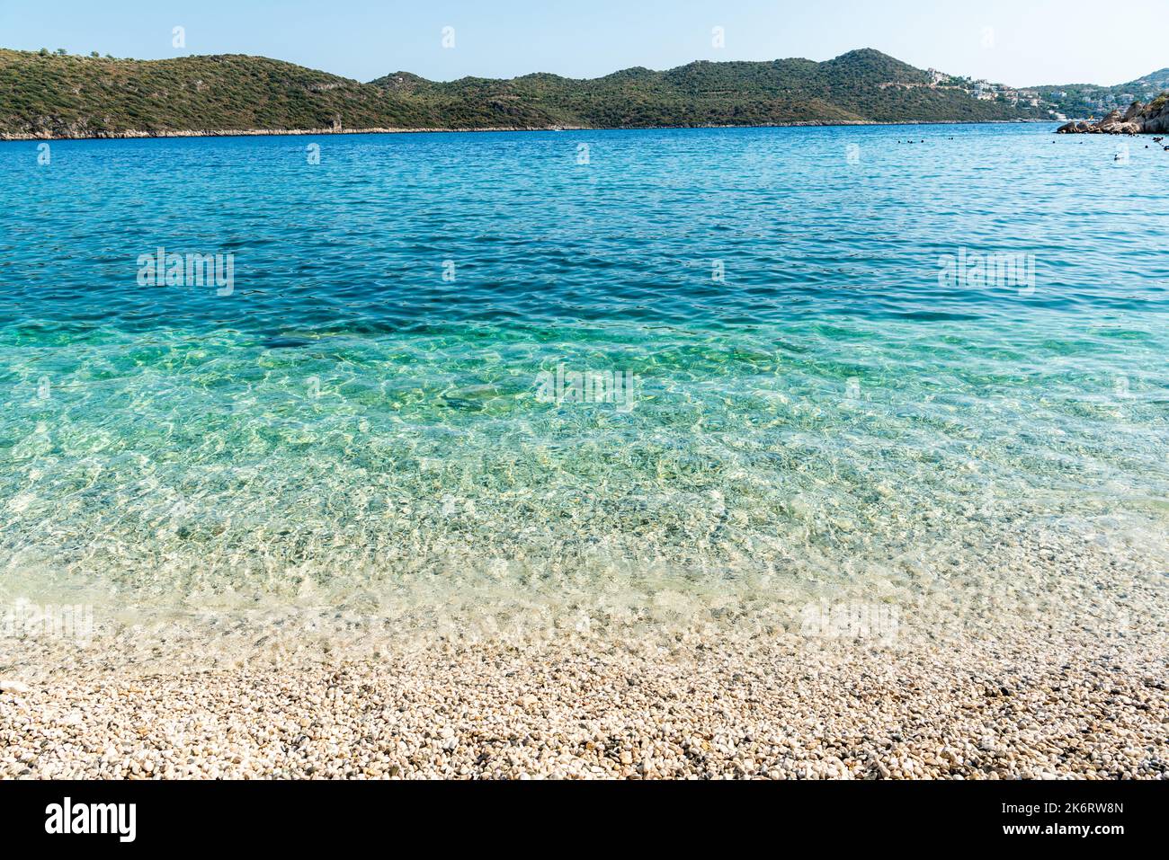 Waters of the Mediterranean sea on Akcagerme pebble beach near Kas ...