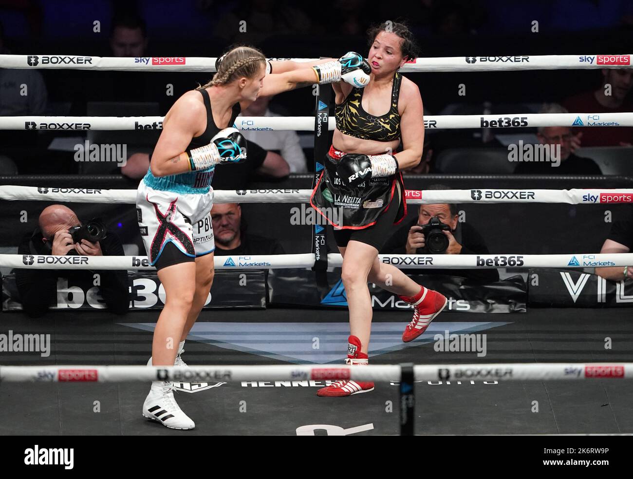 April Hunter (left) and Erica Alvarez in action during their Super ...