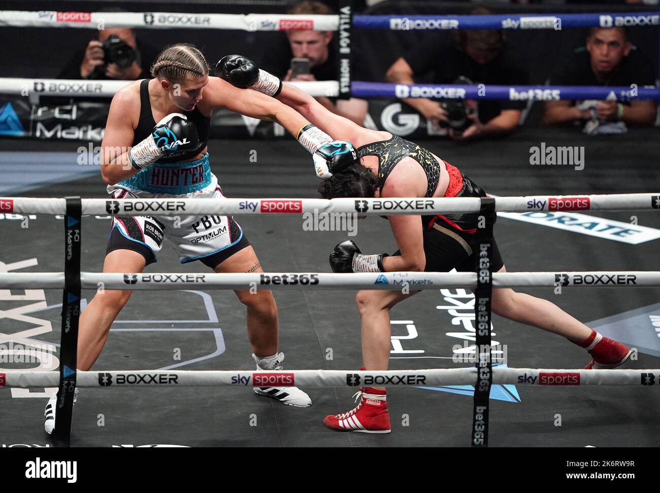 April Hunter (left) and Erica Alvarez in action during their Super ...