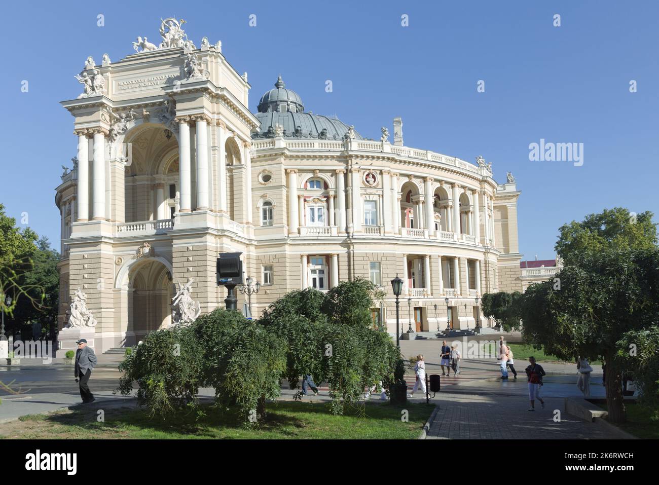 People walks under the building of Opera theater in Odessa, Ukraine on ...