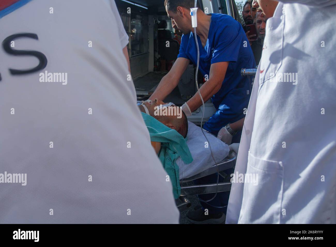 Nablus, Palestine. 15th Oct, 2022. Palestinian paramedics transport an ...