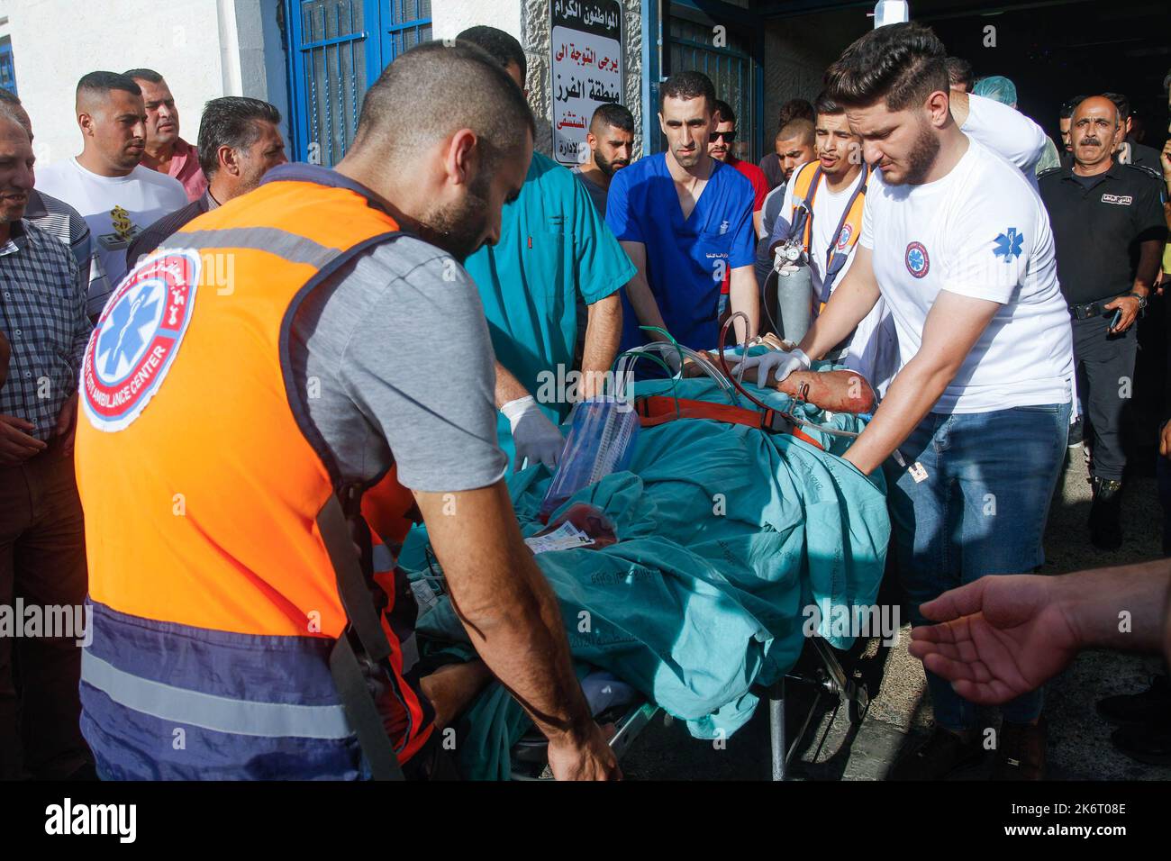 Palestinian paramedics transport an injured Palestinian Mujahid Daoud ...
