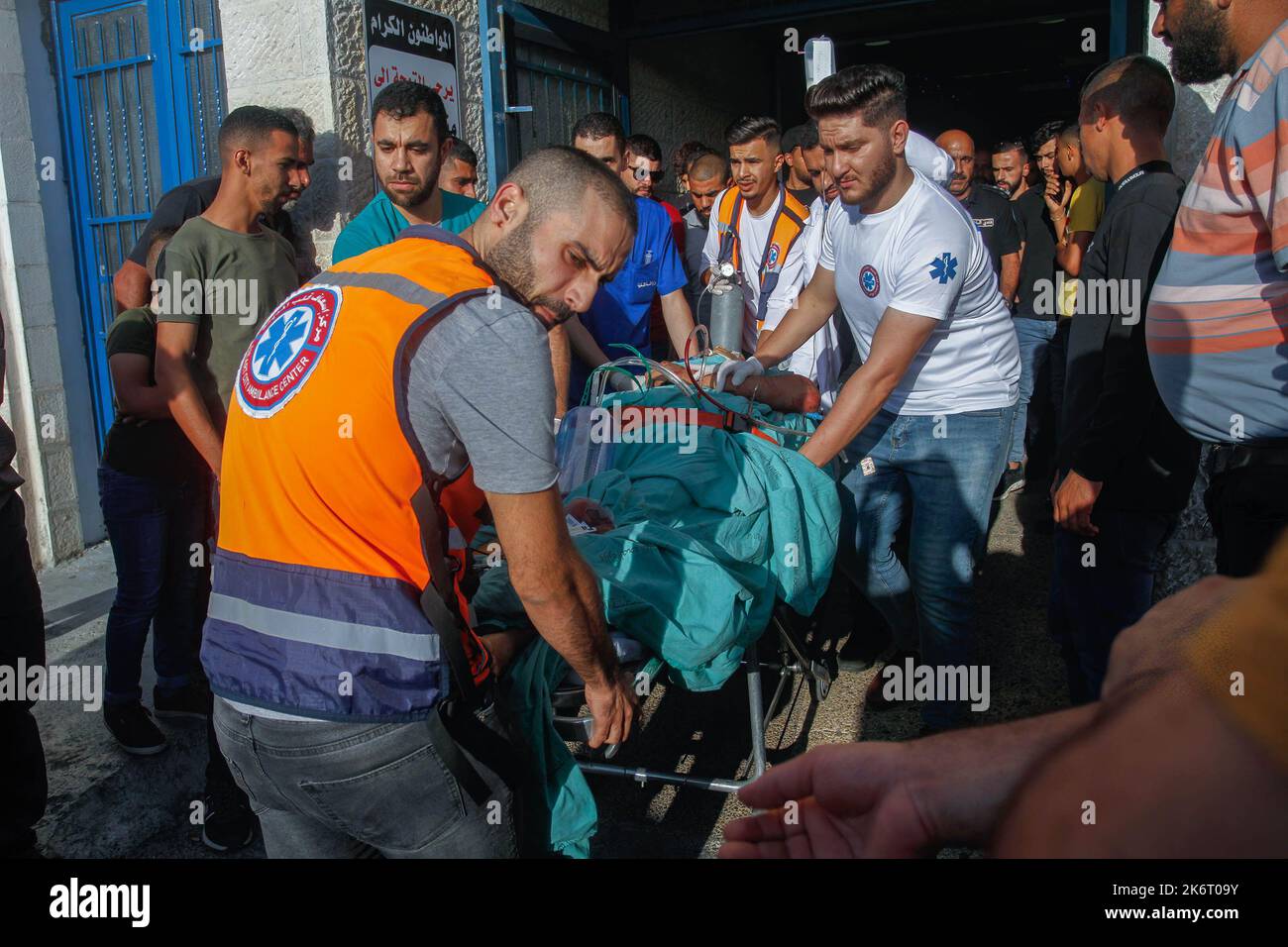 Nablus, Palestine. 15th Oct, 2022. Palestinian paramedics transport an ...