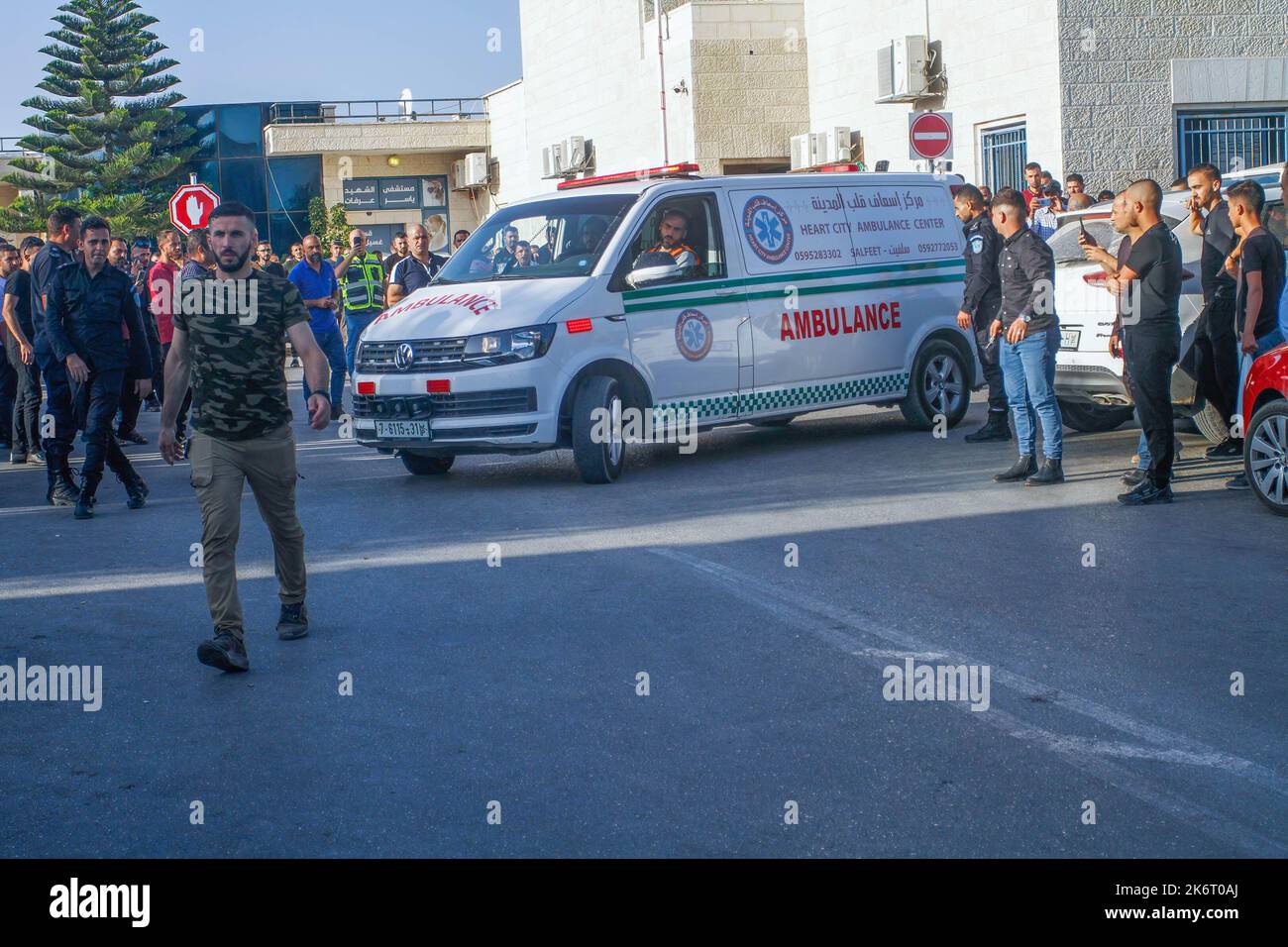 Nablus, Palestine. 15th Oct, 2022. Palestinian paramedics transport an ...