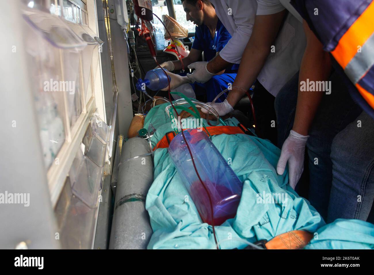Nablus, Palestine. 15th Oct, 2022. Palestinian paramedics transport an ...