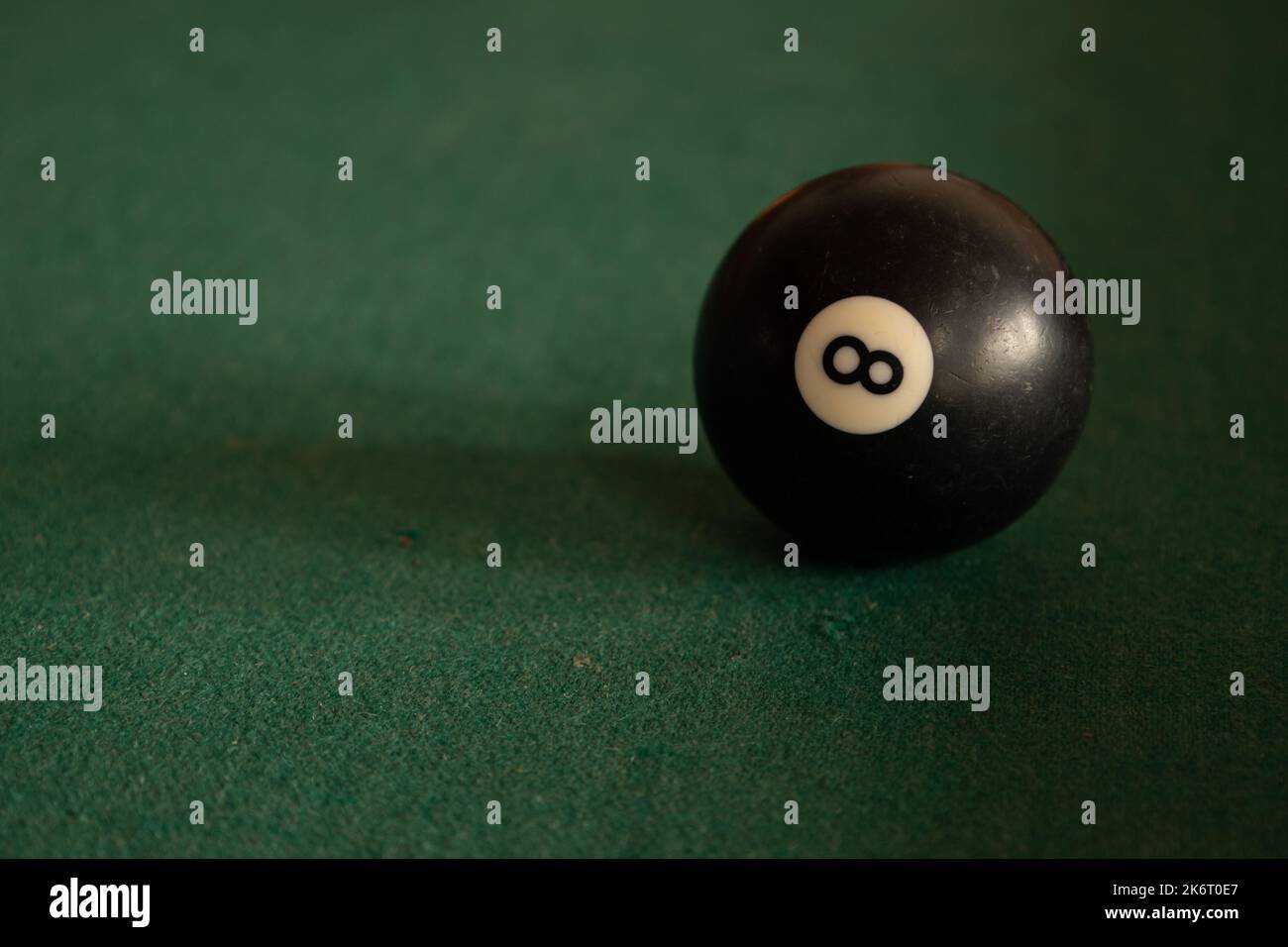 Bar game with balls and a stick on a pool table. Entertainment with ...