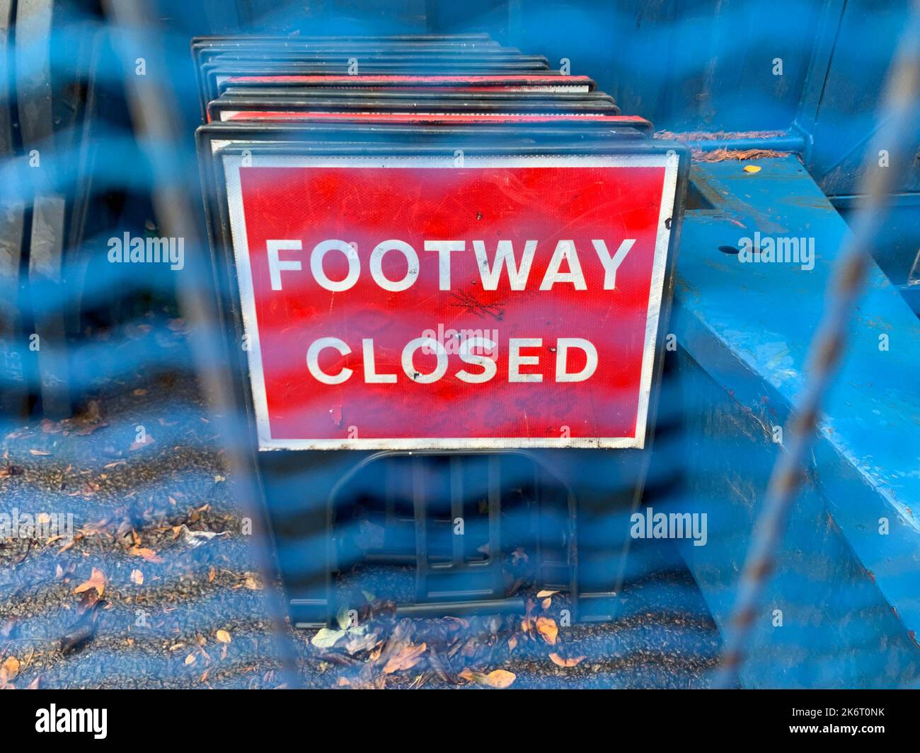Close up of a rectangular traffic sign red inside with white letters ...