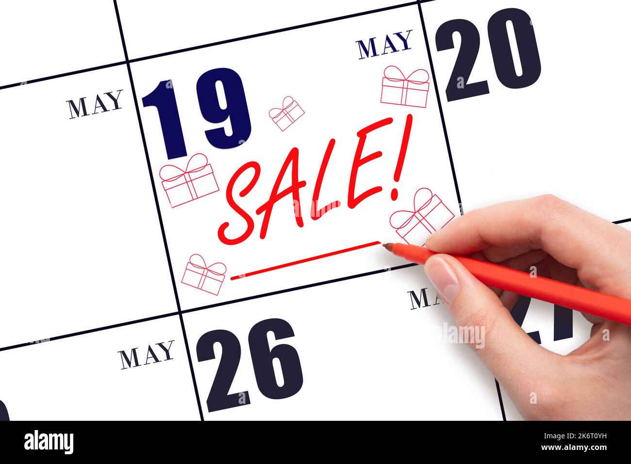 19th day of May. Hand writing text SALE and drawing gift boxes on ...
