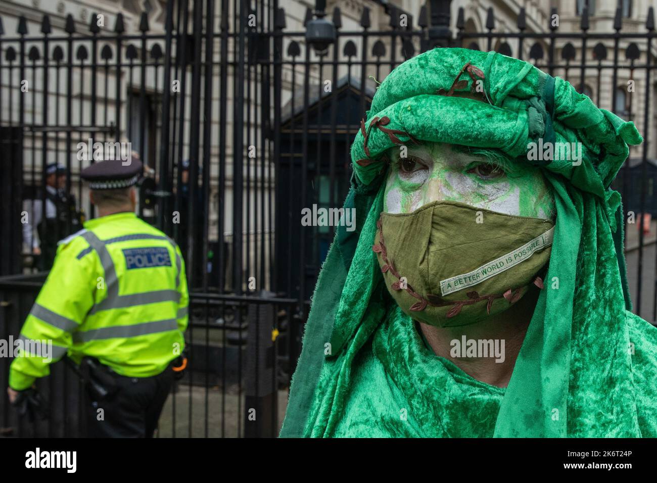 London, UK. 14th October, 2022. An Extinction Rebellion Green Rebel ...