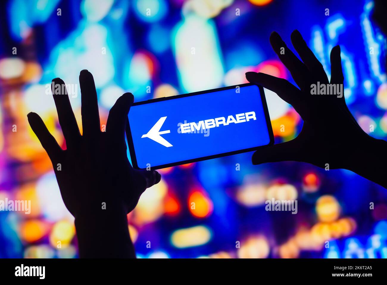 In this photo illustration, the Embraer S.A. logo is displayed on a ...