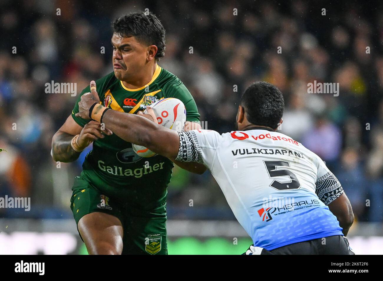 Latrell Mitchell of Australia is tackled by Mitieli Vulikijapani of ...