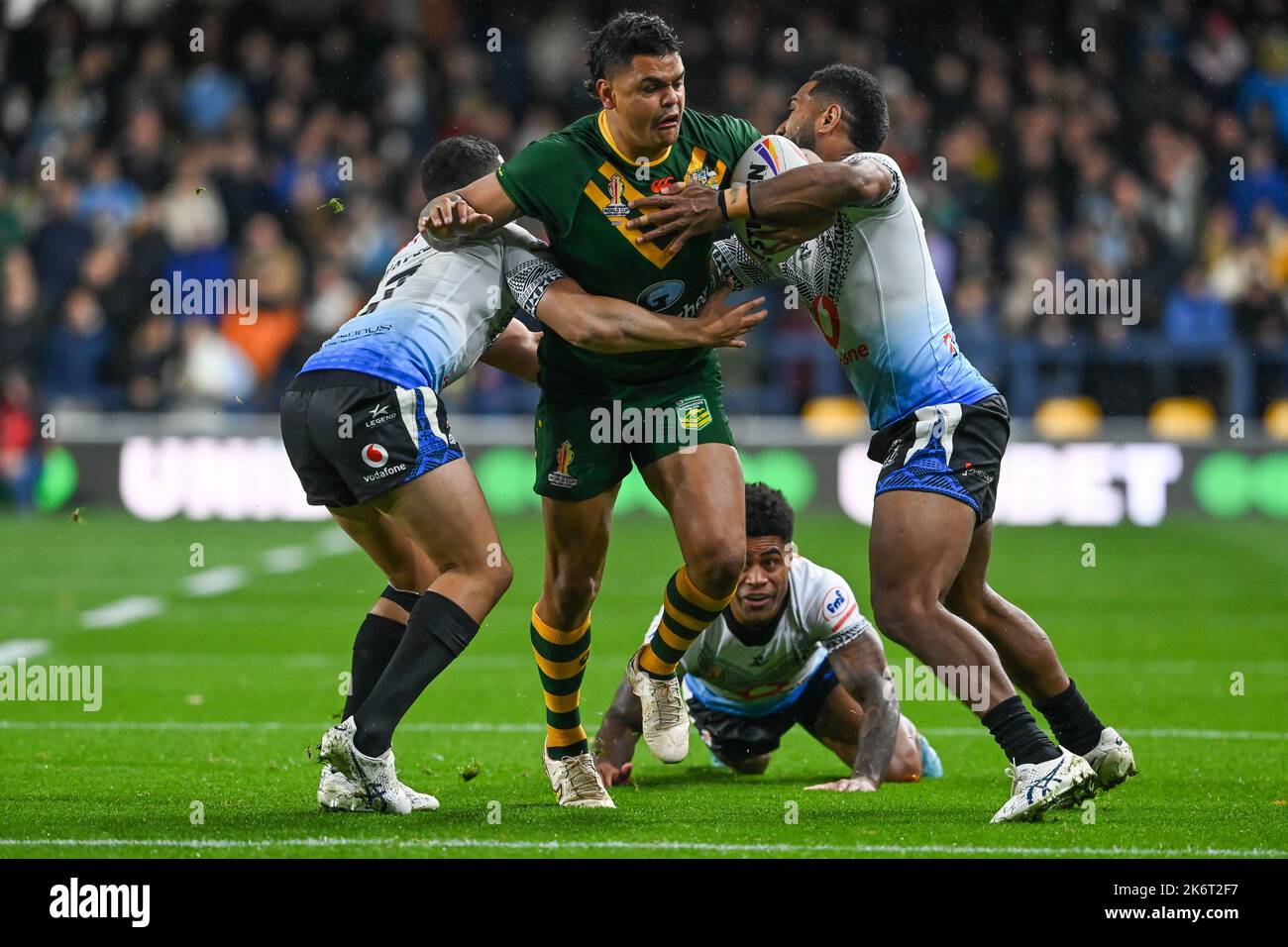 Latrell Mitchell of Australia is tackled by Mitieli Vulikijapani and ...