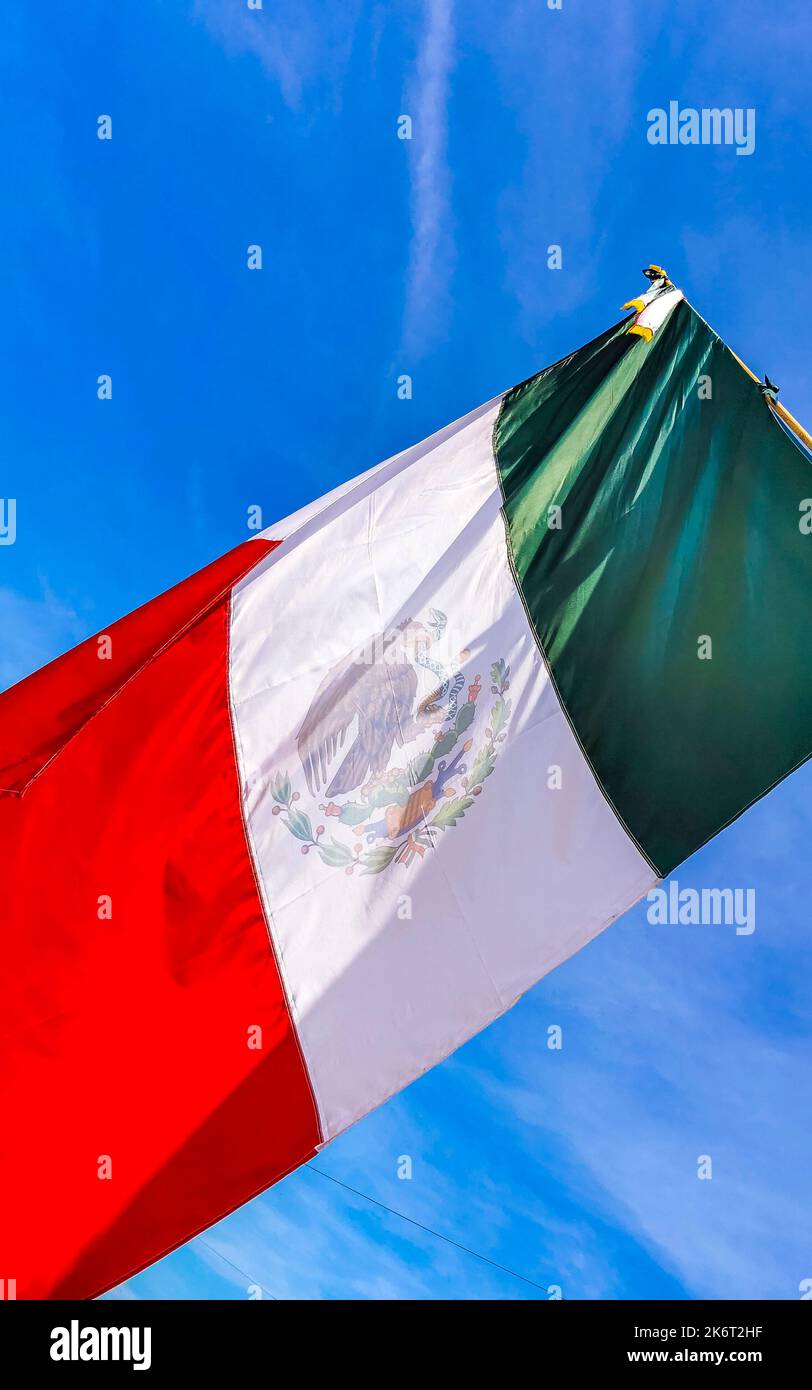 Mexican green white red flag with blue sky and clouds in Zicatela ...