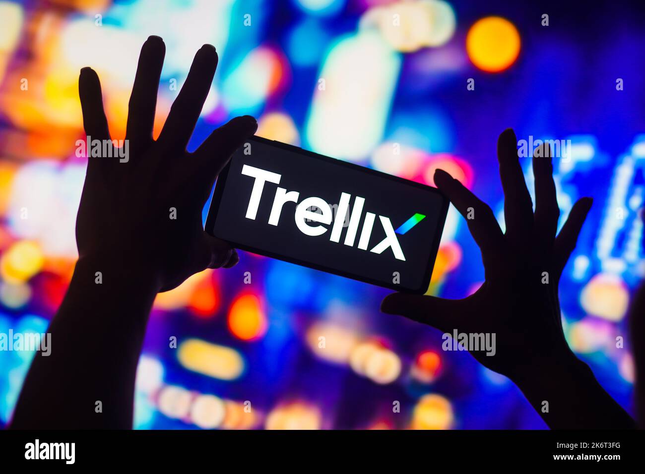 In this photo illustration, the Trellix logo is displayed on a ...