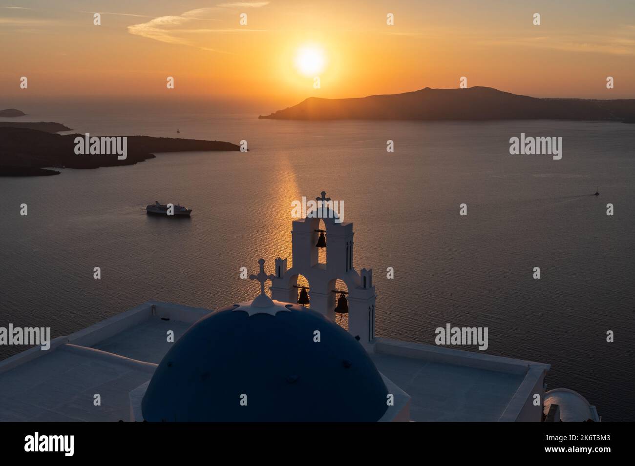View of the sunset with The Three Bells of Fira, officially known as ...