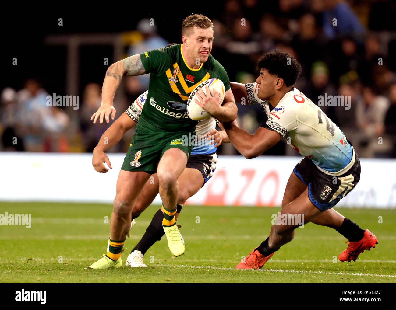 Australia's Cameron Munster (centre) is tackled during the Rugby League ...