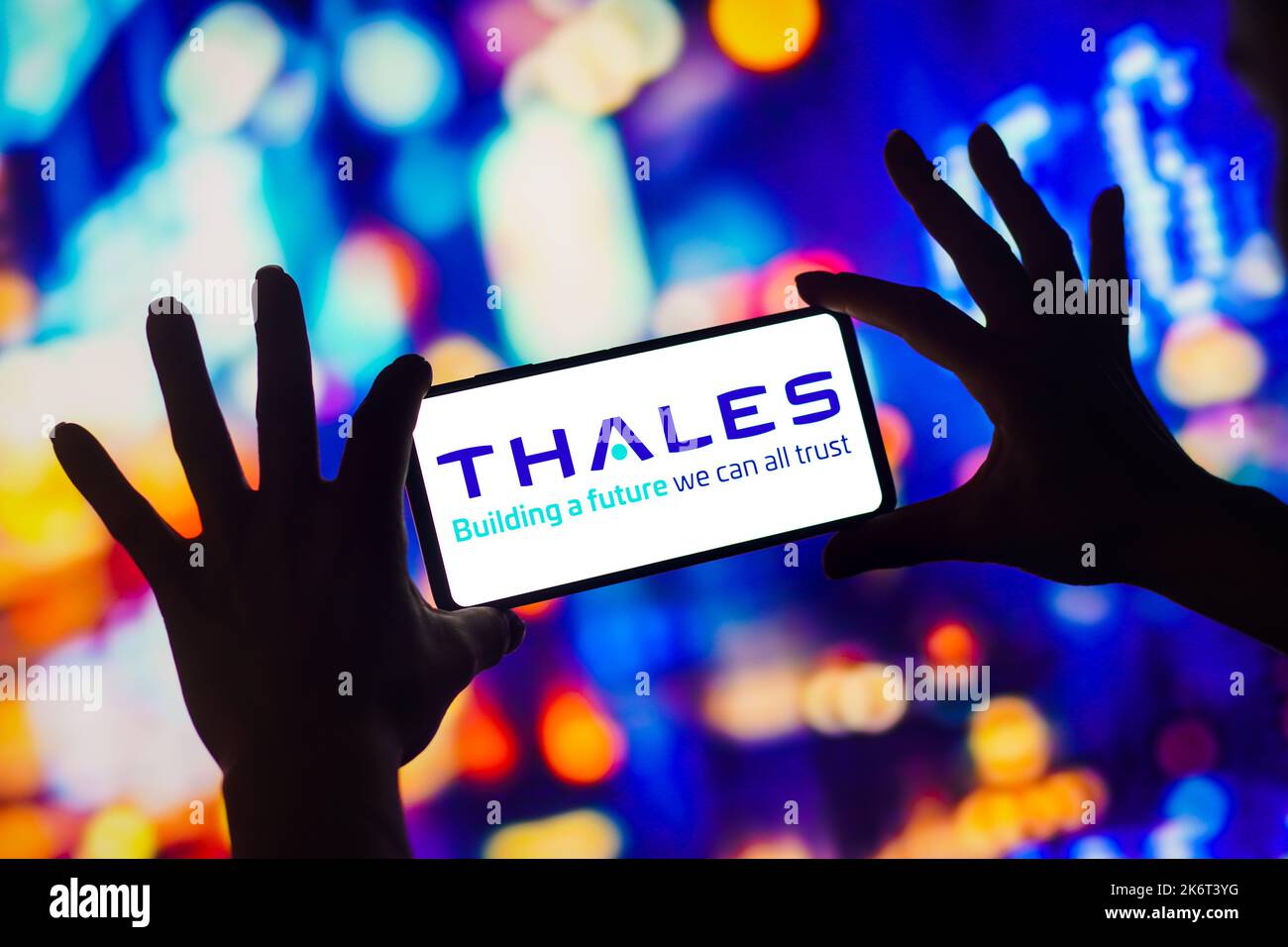 In this photo illustration, the Thales Group logo is displayed on a ...