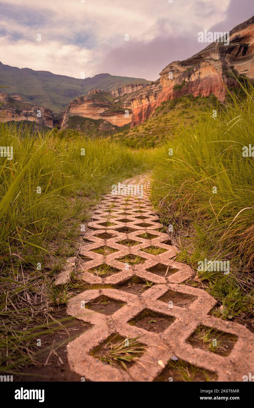 A concrete path through the grass on the Mushroom Rock hiking trail in ...