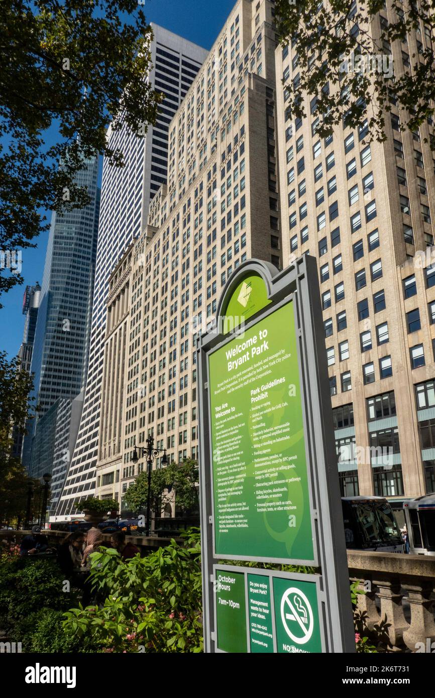 Informational sign for Bryant park in front of skyscrapers on W. 42nd ...