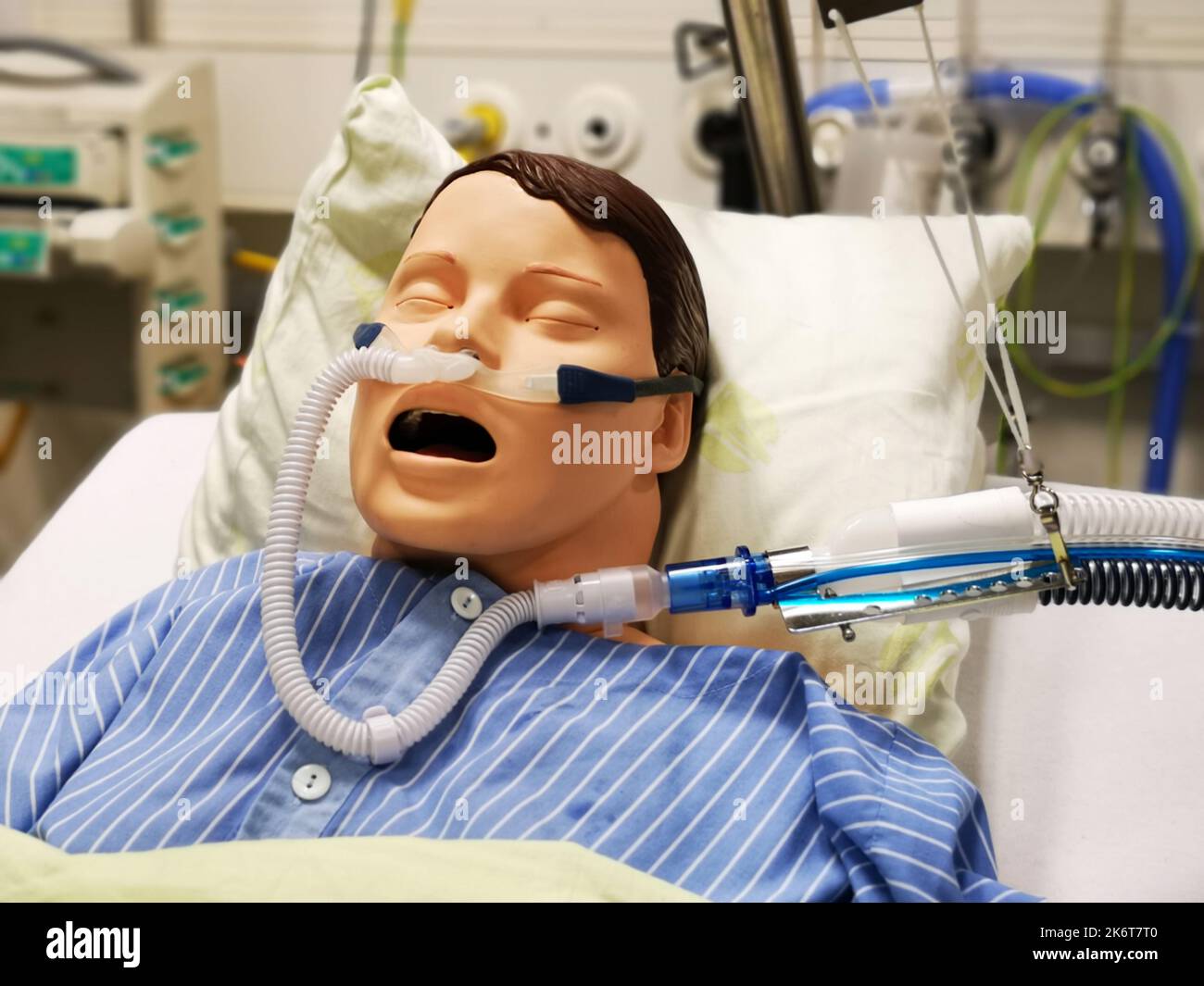 medical dummy with endotracheal tube lying on hospital bed Stock Photo ...