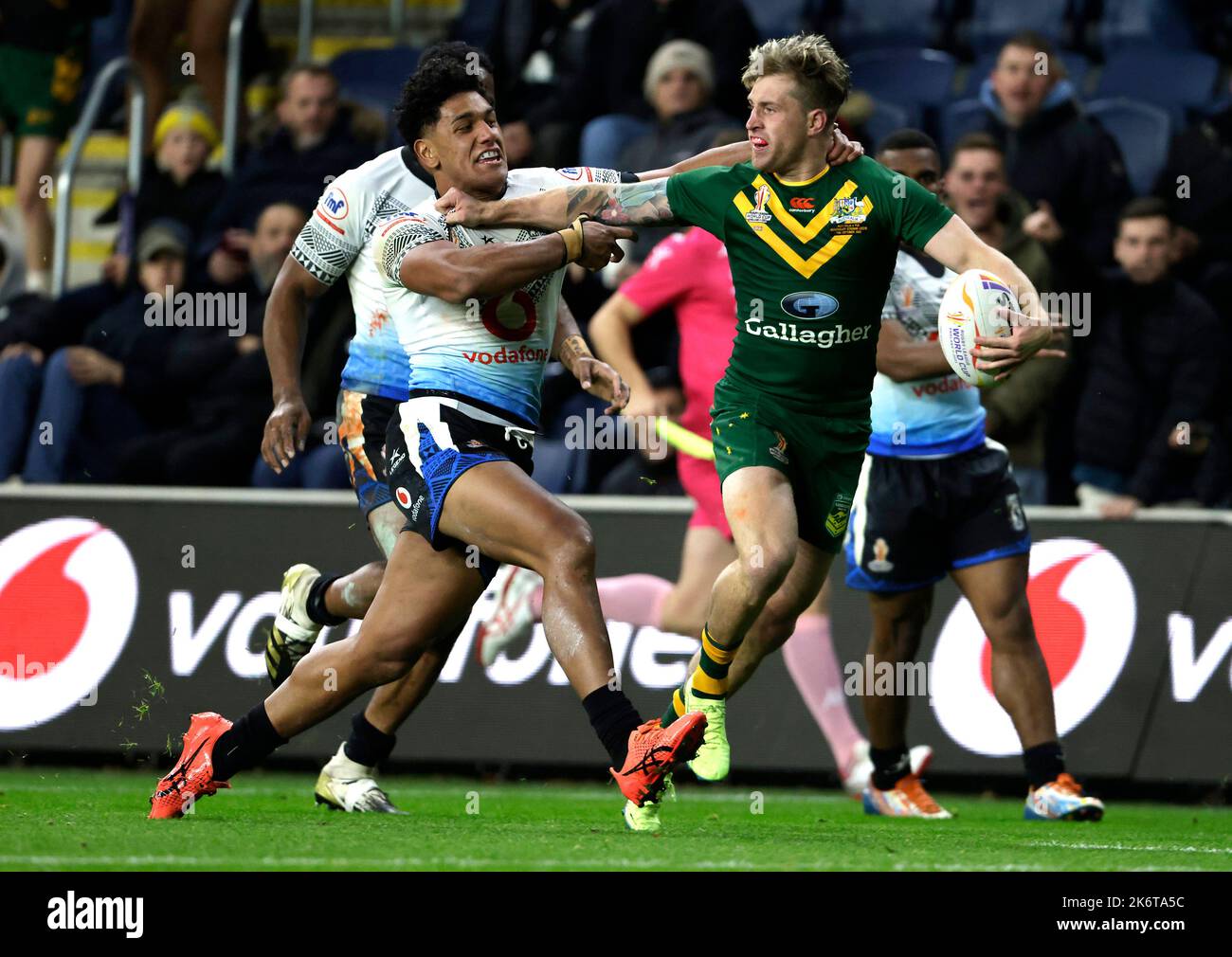 Australia's Cameron Munster (right) attempts to get away from pressure ...