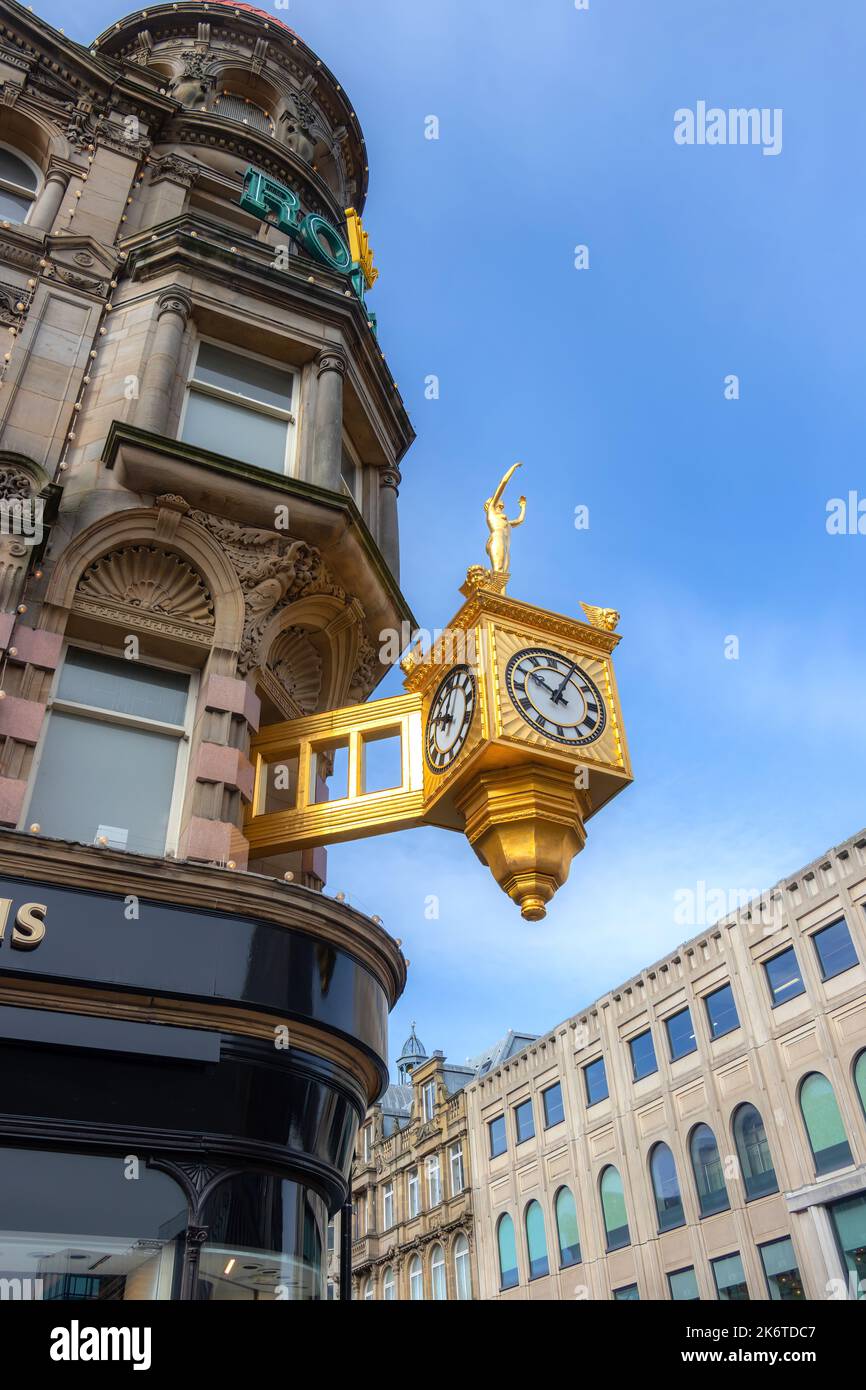 golden ornate clock and gold figurine in front of Northern Goldsmiths ...