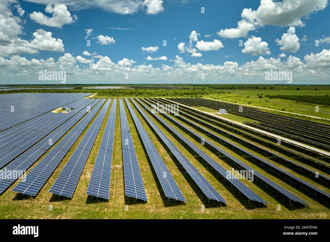 Aerial view of large sustainable electrical power plant with rows of ...