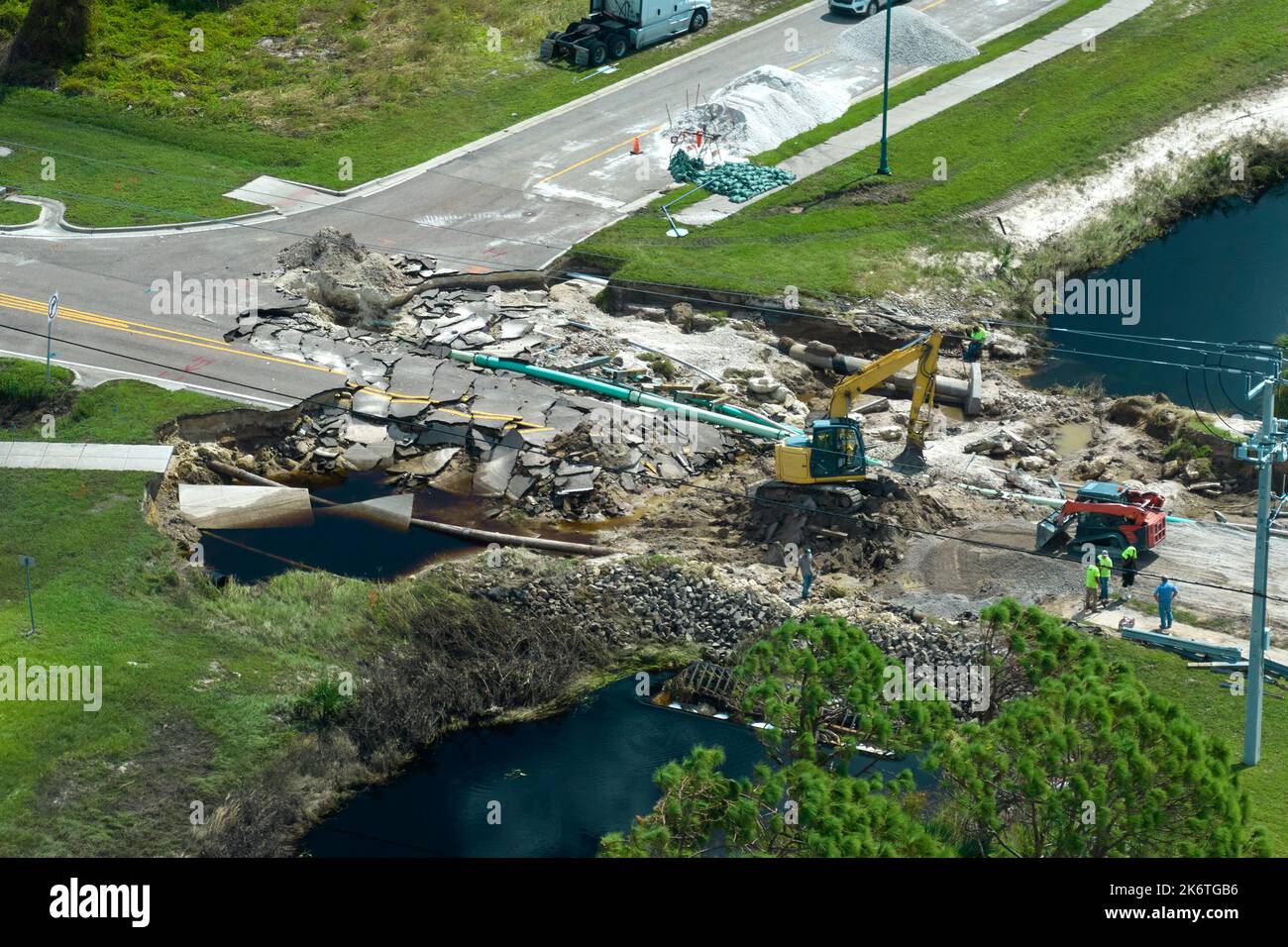 Aerial view of reconstruction of damaged road bridge destroyed by river ...