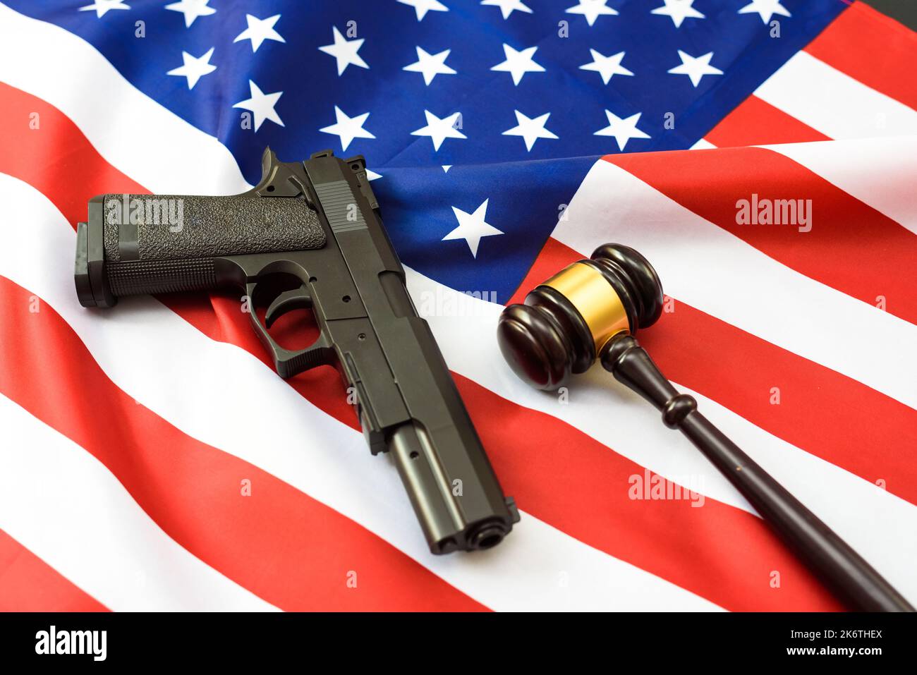Judges rule on the use of civilian weapons, patriotic flag with pistol ...