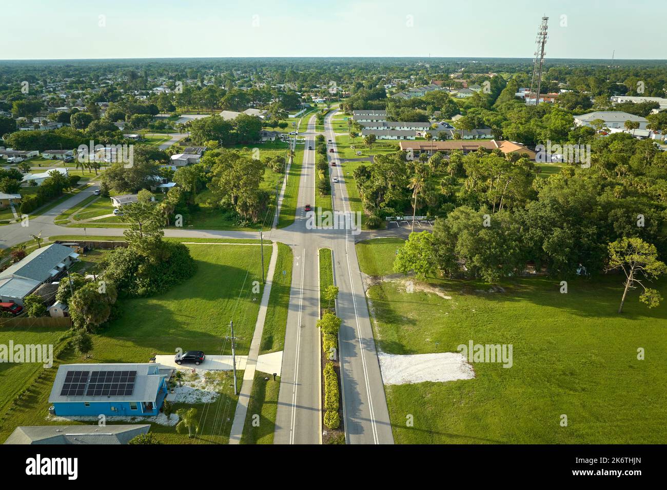 Aerial view of street traffic with driving cars in small town America ...
