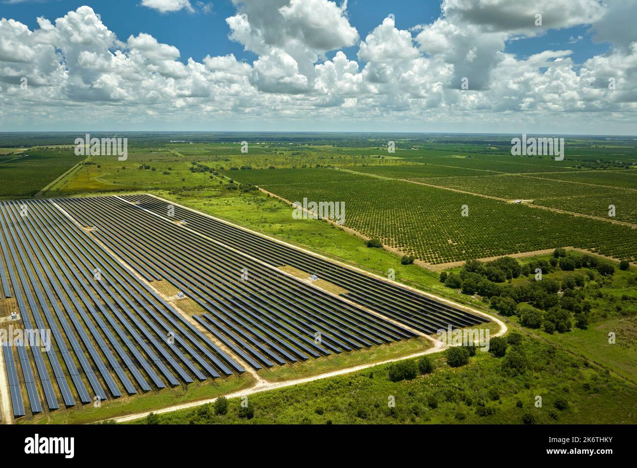 Aerial view of sustainable electrical power plant between agricultural ...