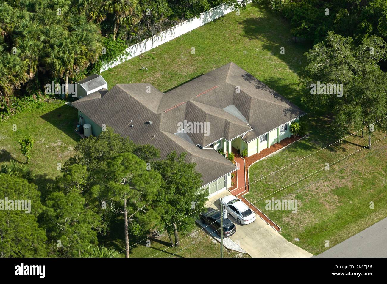 Aerial view of typical contemporary american private house with roof ...